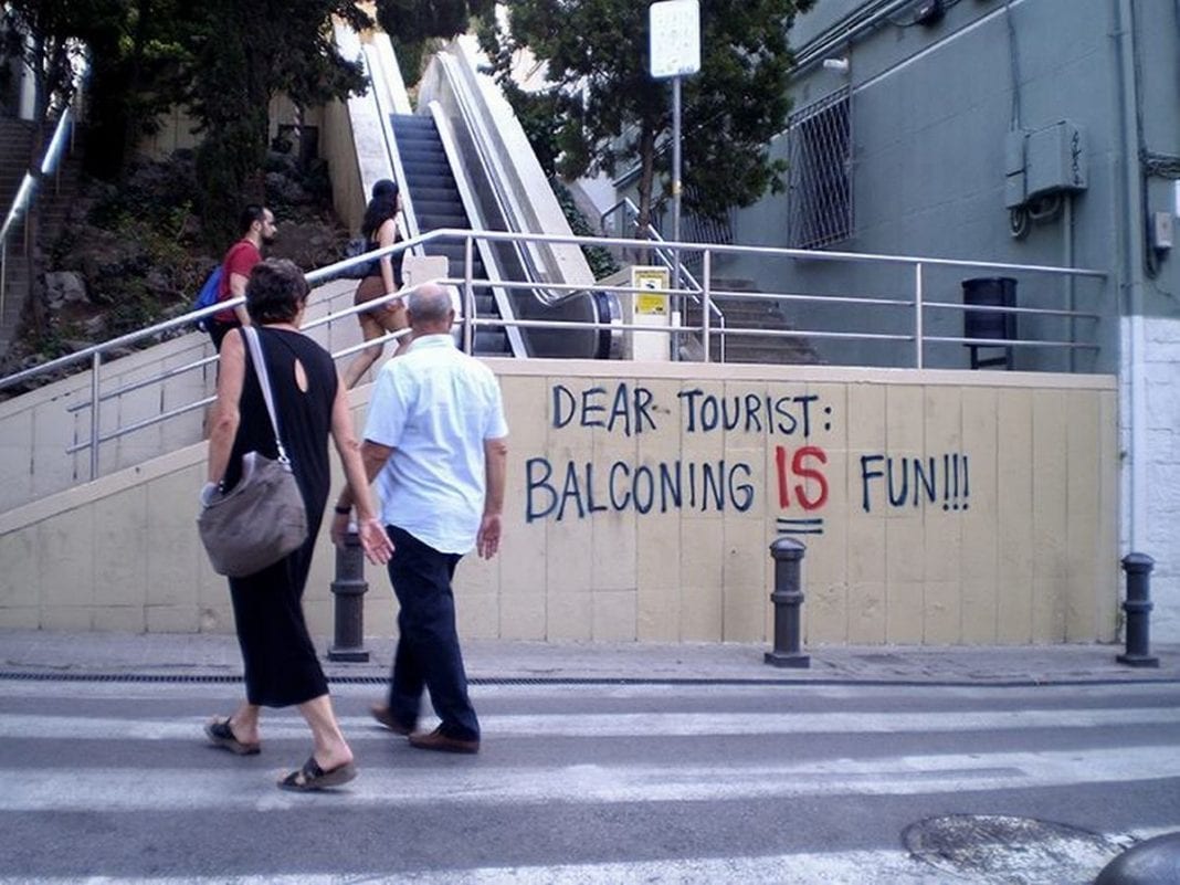Posters encouraging tourists to jump off balconies spotted in Brit ...