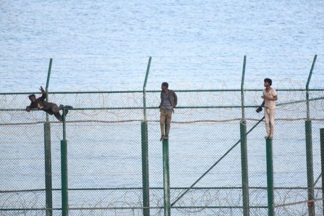 Over 150 African immigrants scale two HUGE fences to enter Spain's ...