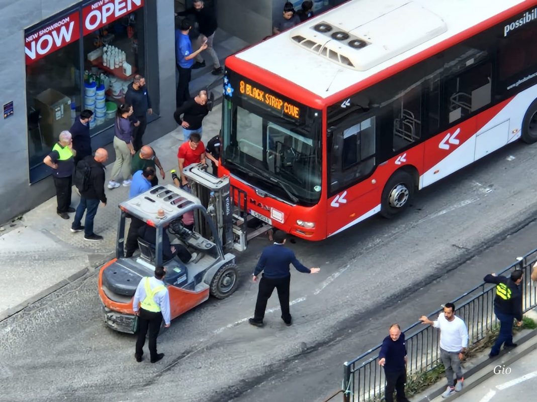 A forklift helped free a woman after a bus ran her over near a ...
