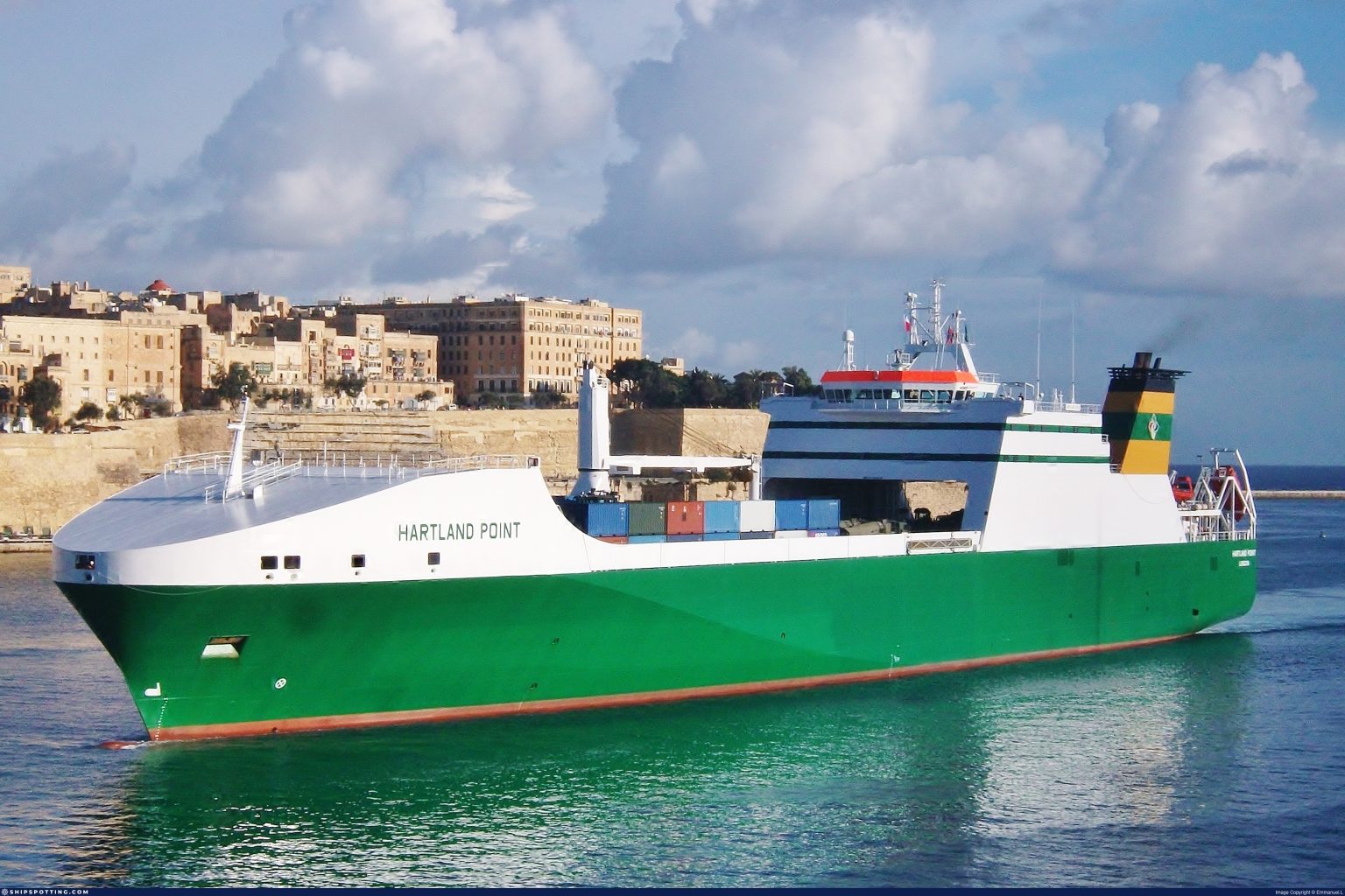 British merchant ship rescues more than 50 migrants from an inflatable ...
