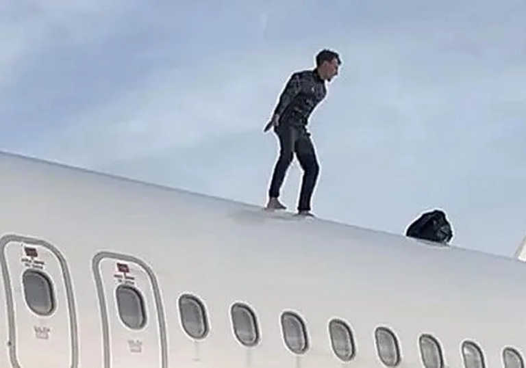 WATCH: Alarming moment young man with suspicious backpack climbs onto ...
