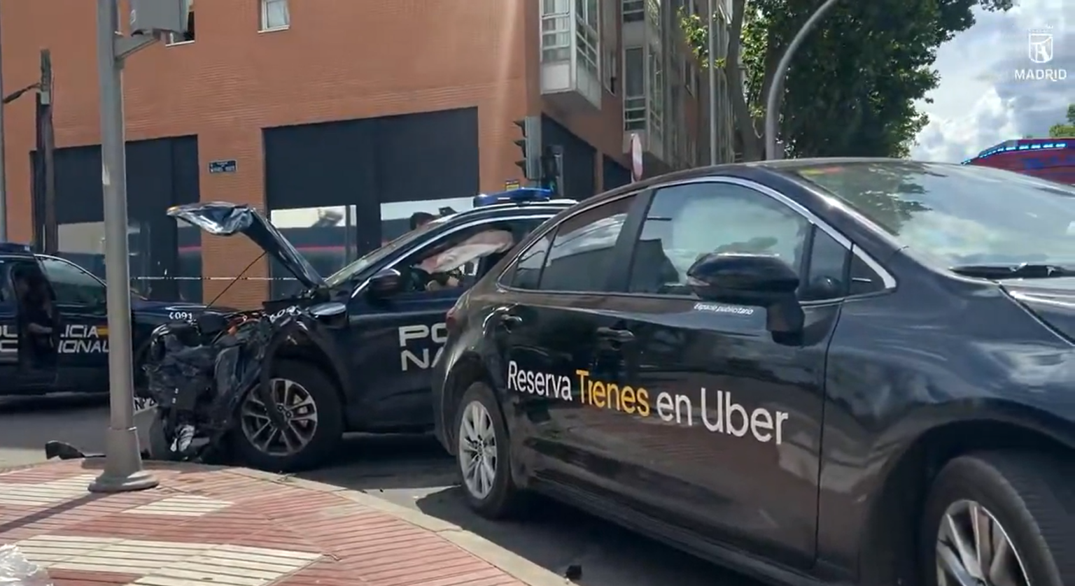 Firefighters cut woman out of car after Madrid crash involving police